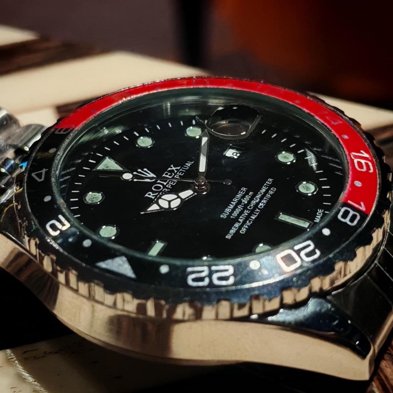 Black and red luxury watch with silver accents... - Depop