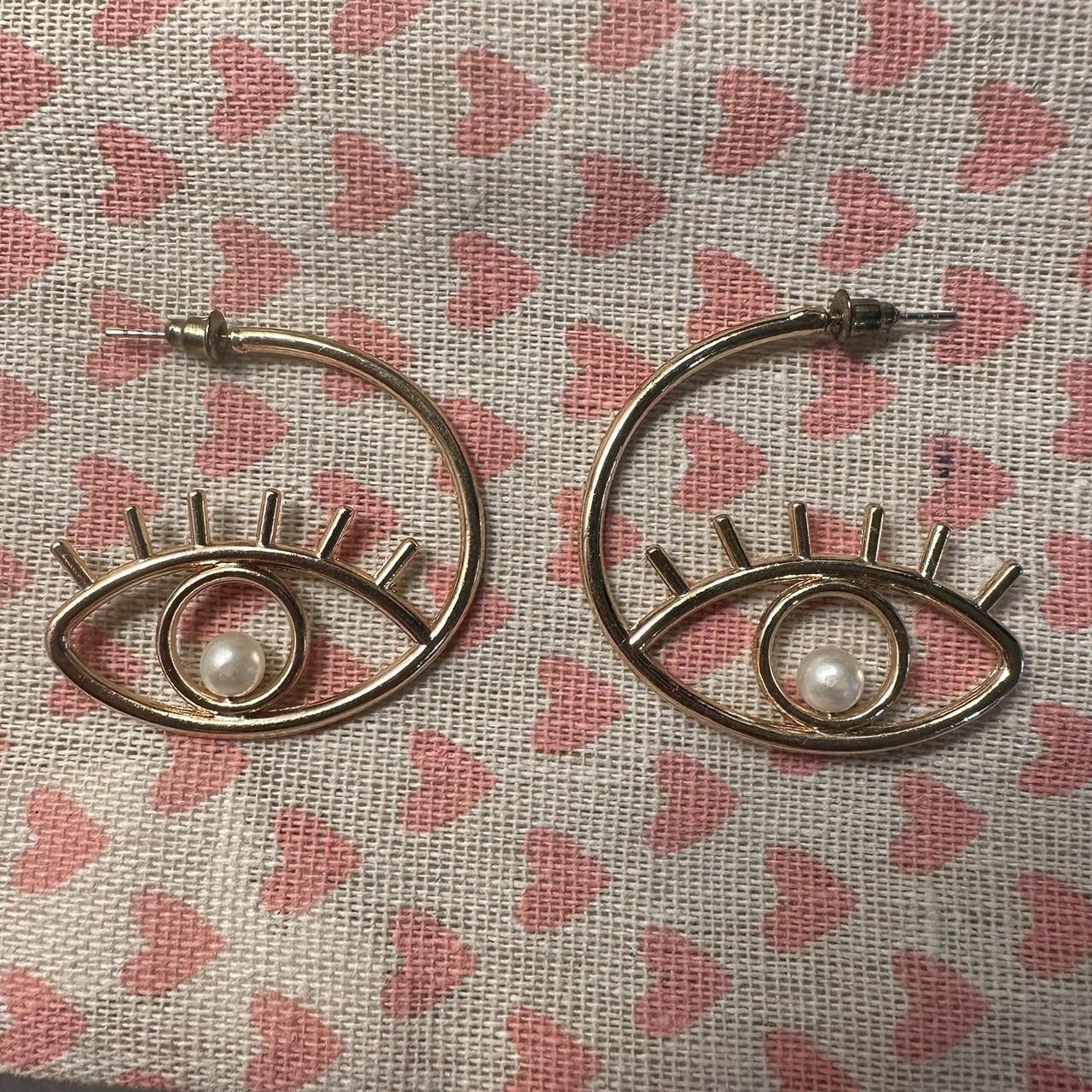 Super cool gold eye shaped earrings with faux pearl... - Depop