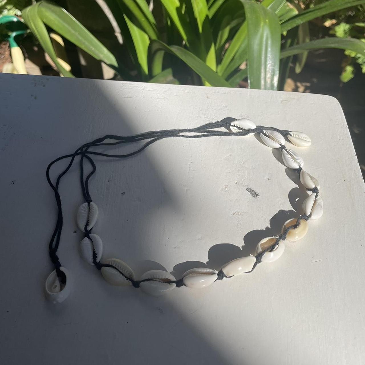 the cutest black cowrie shell necklace a summer must... - Depop