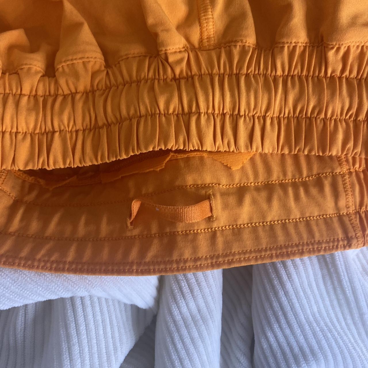 Orange Lululemon hotty hots, inside lining has been... | Depop