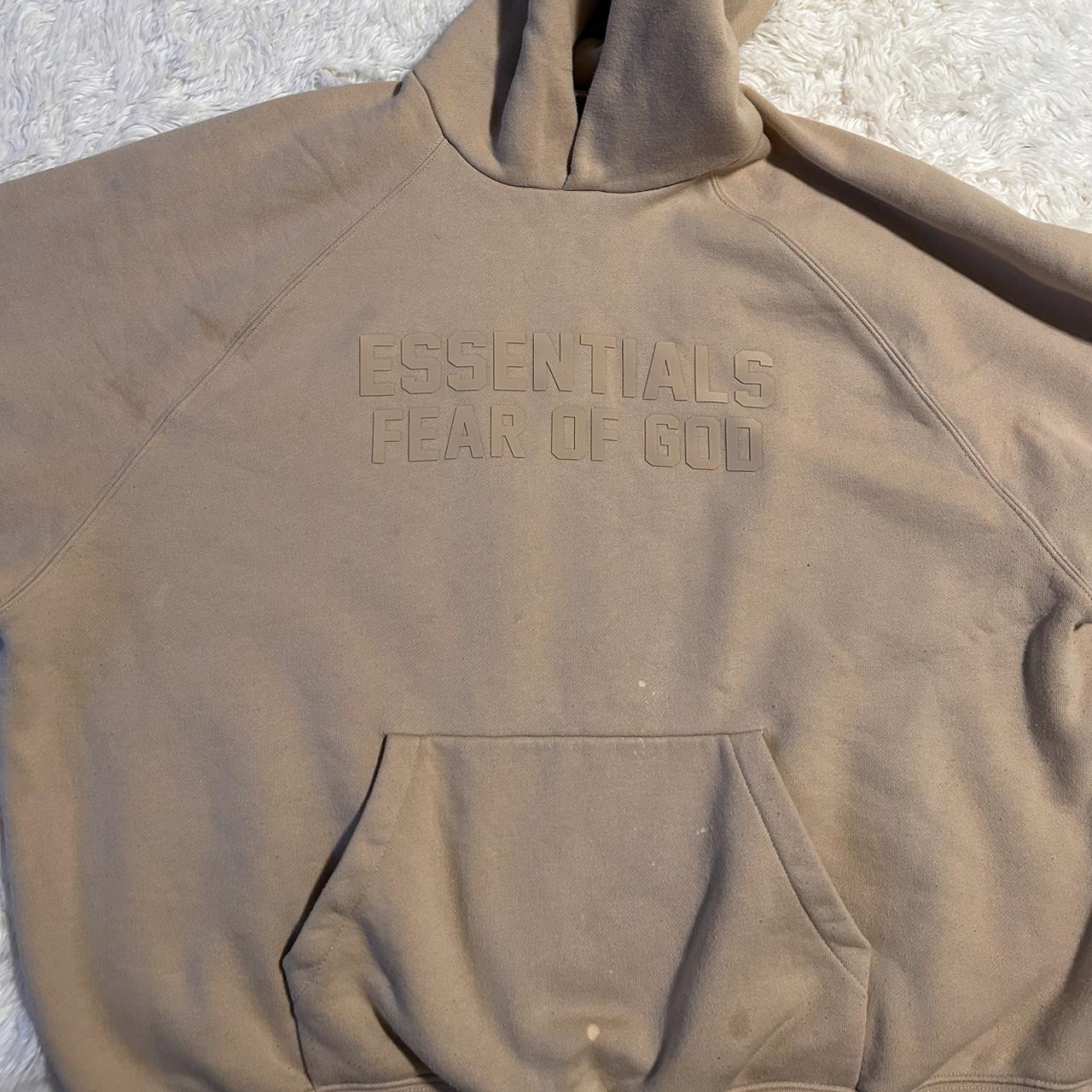 Essentials hoodie sand few bleach stains but barley... - Depop