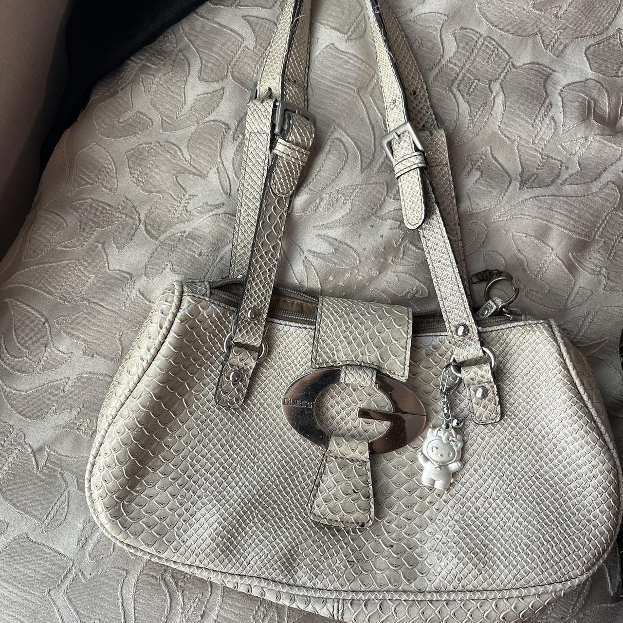 guess silver bag has some little strings coming out... - Depop