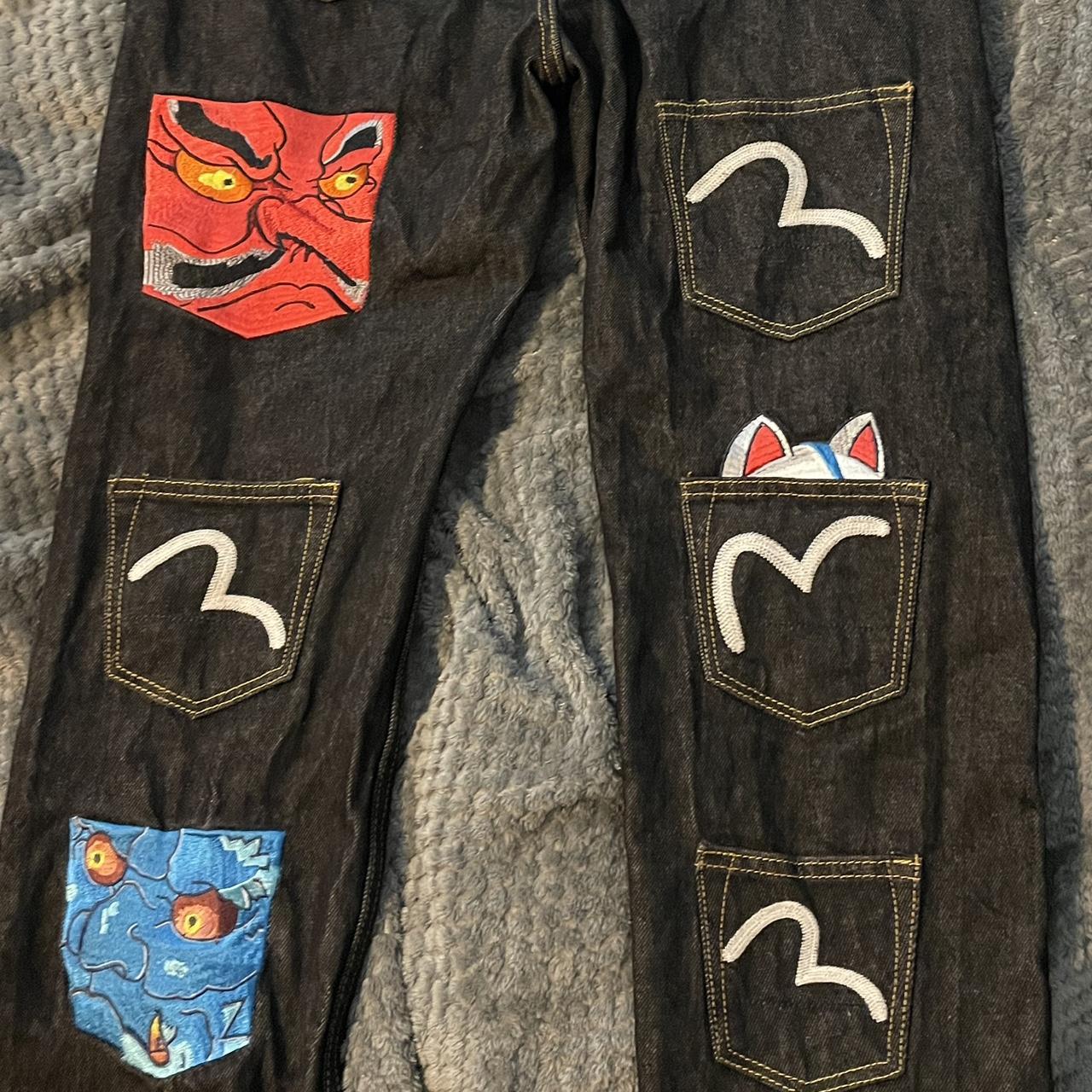 Black evisu jeans with designs down back real... - Depop