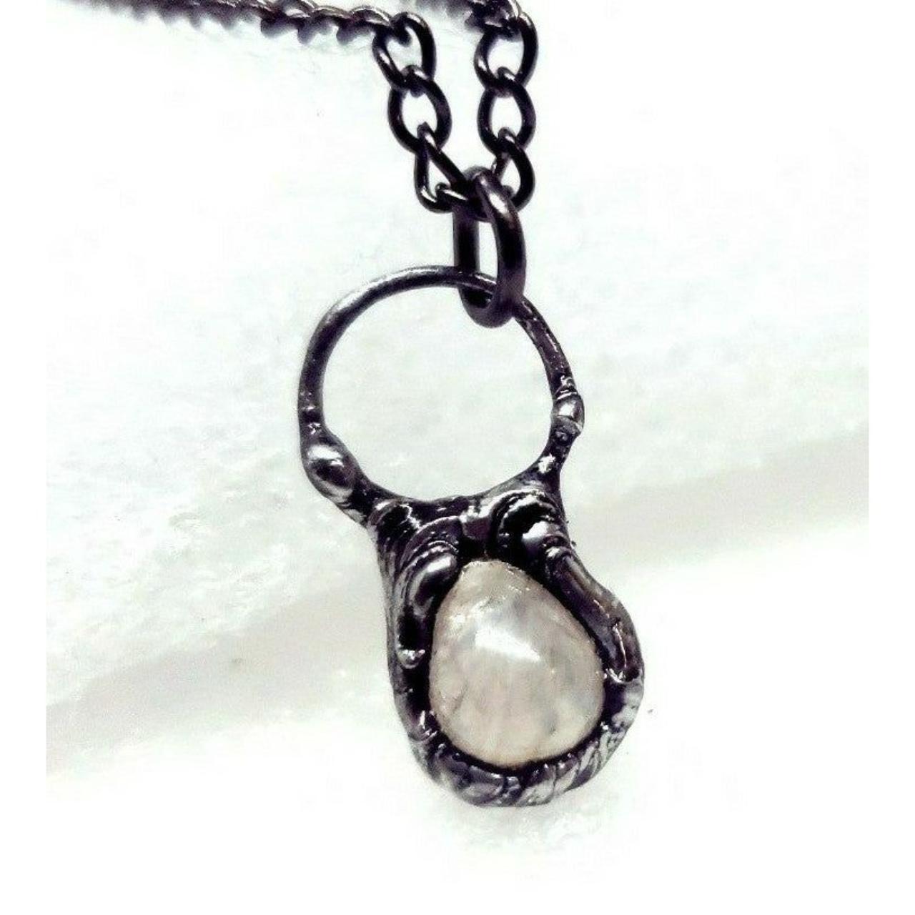 An amazingly unique tiny moonstone cystal tear drop... - Depop