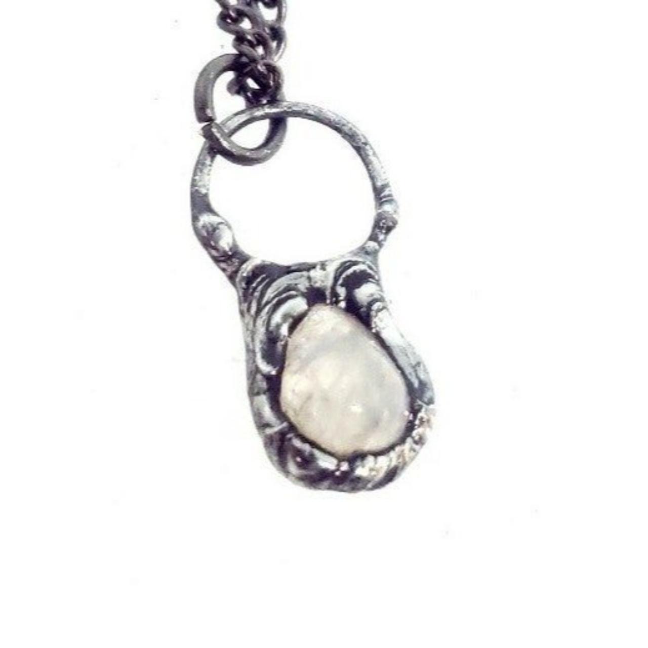 An amazingly unique tiny moonstone cystal tear drop... - Depop