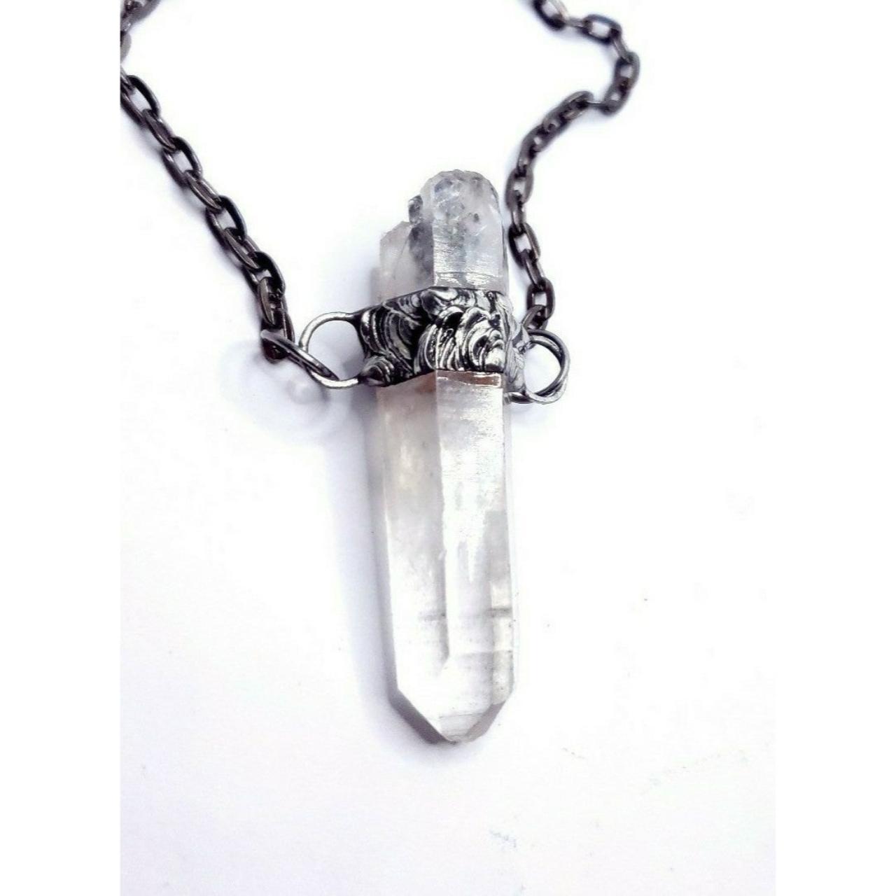 A unique and amazing raw Quartz crystal crafted into... - Depop
