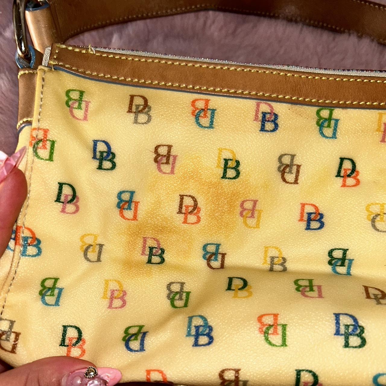 Dooney & Bourke yellow handbag 🎀, only major flaw is... - Depop