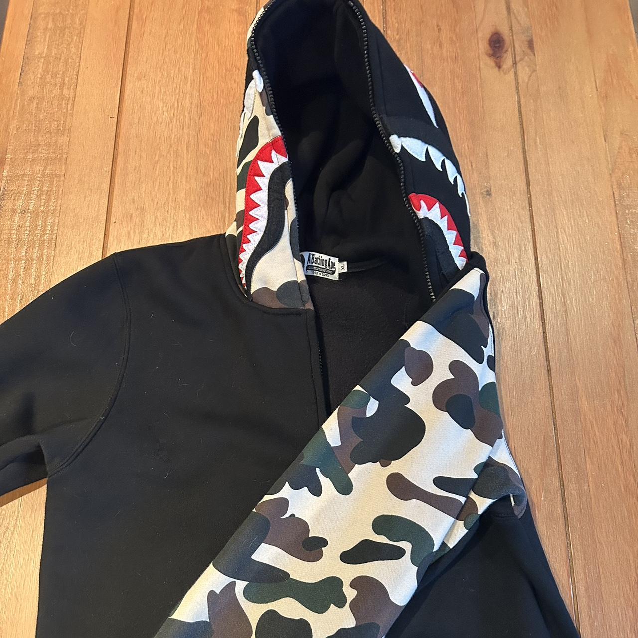 BAPE zip up hoodie in black with camouflage sleeve... - Depop