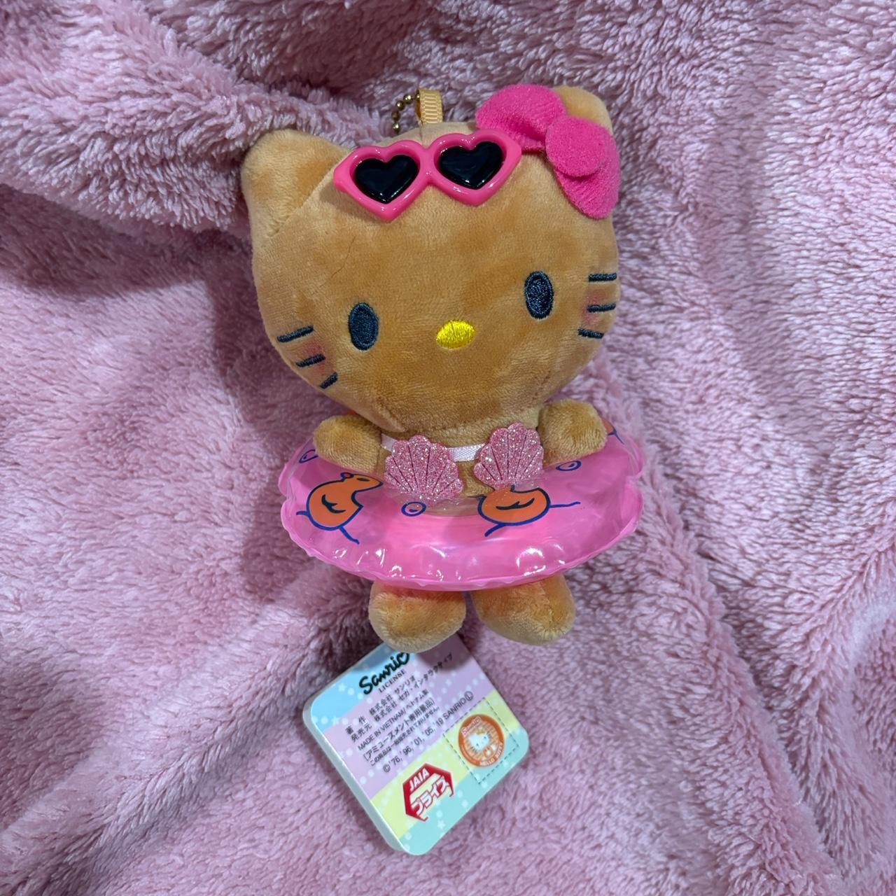 Tan, pool floaty Hello Kitty plush keychain No... | Depop