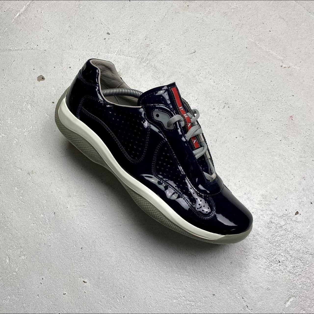 Prada Americas cup trainer Rare perforated patent... - Depop