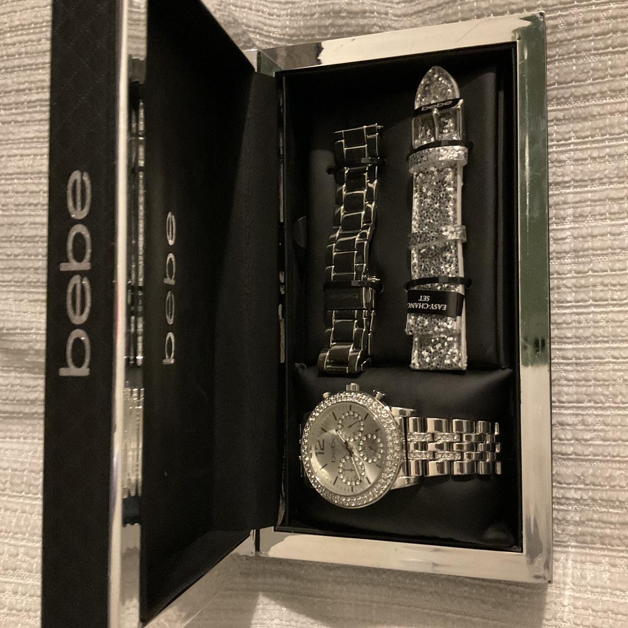 A silver watch with a change in band. - Depop