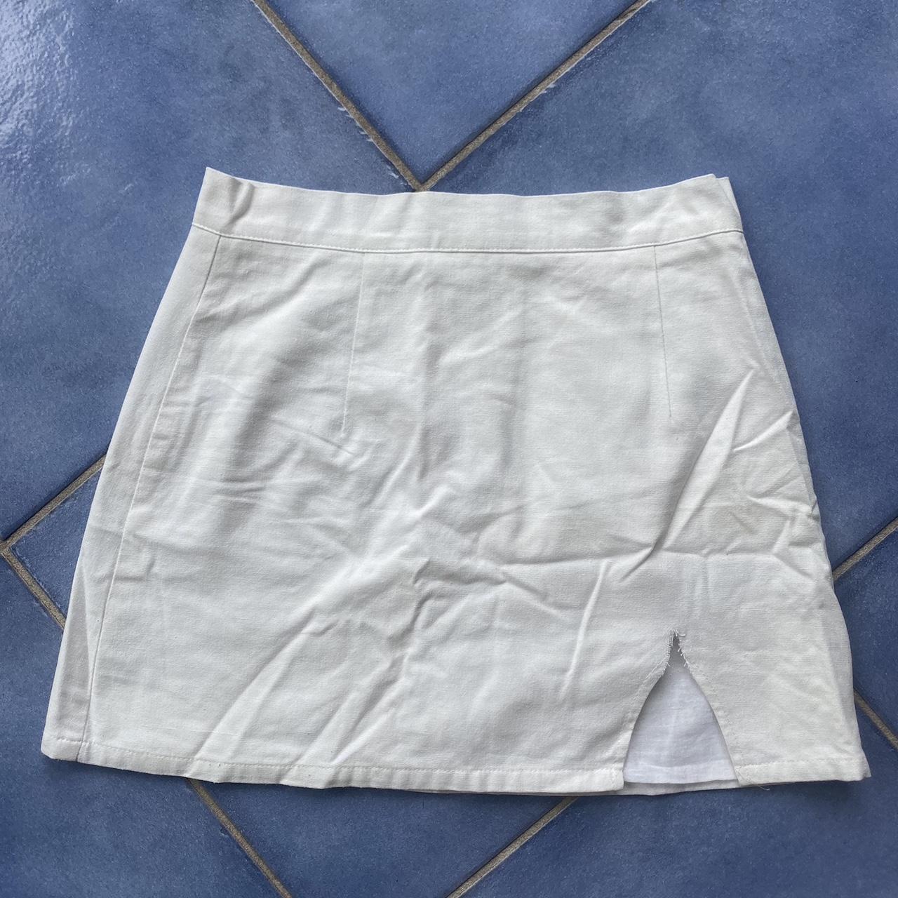 My girl white skirt size 6. Small tare in the split - Depop