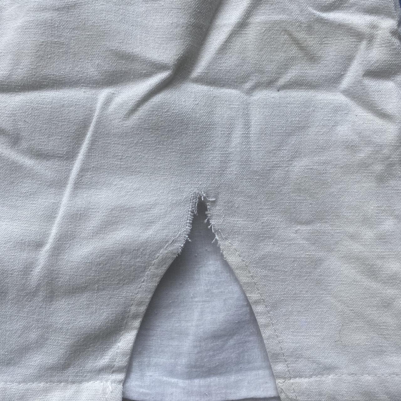 My girl white skirt size 6. Small tare in the split - Depop