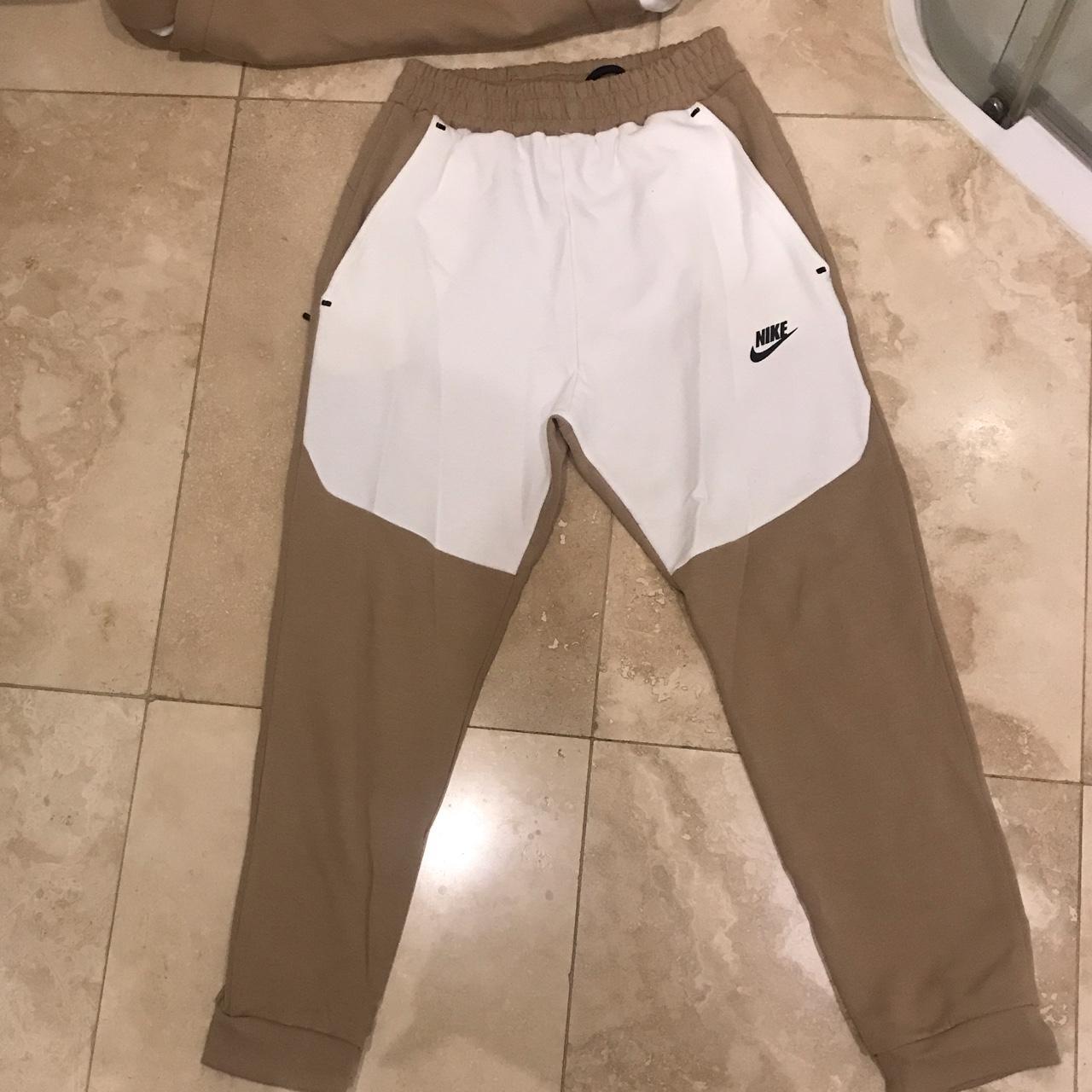 Beige and white Nike tech fleece never worn size ... - Depop