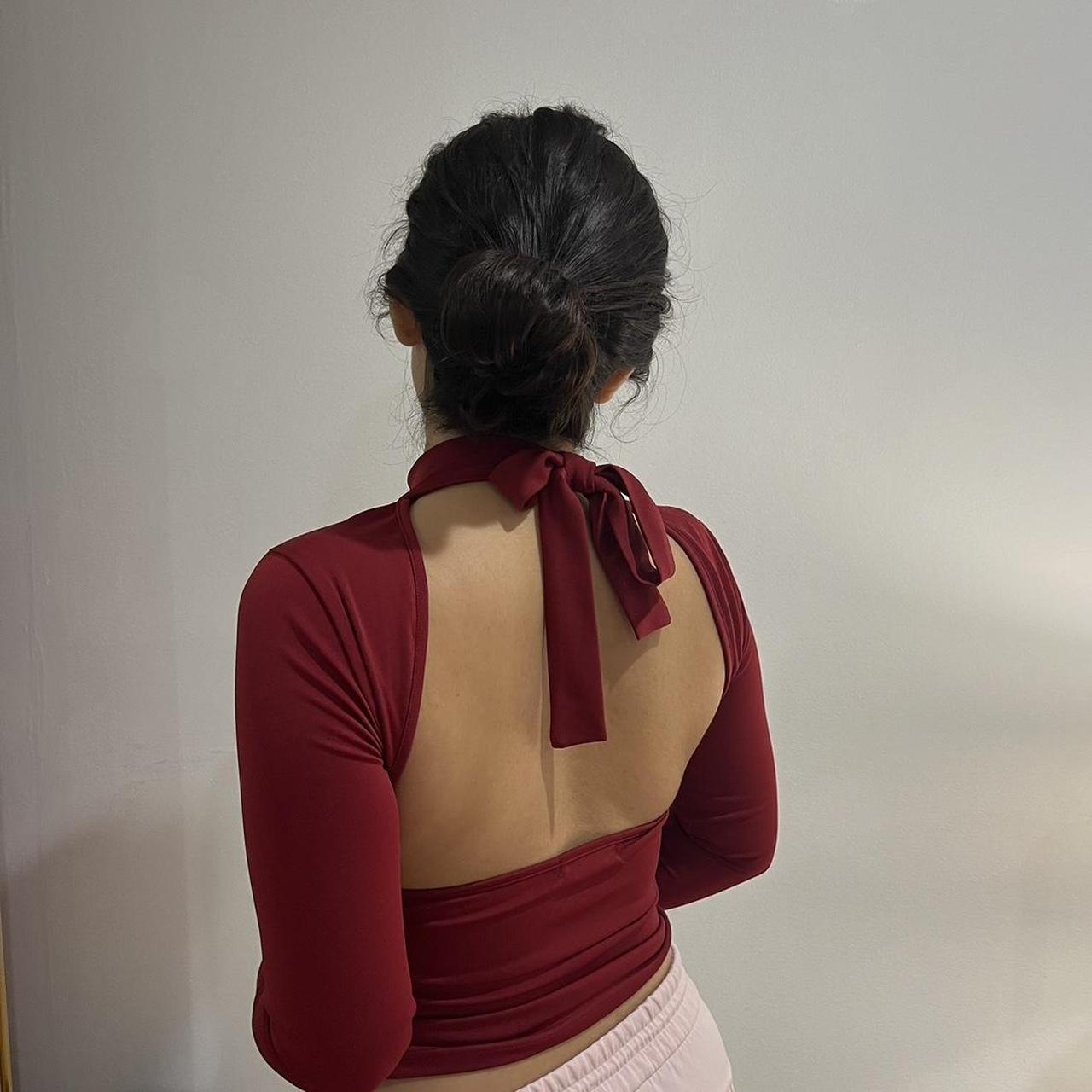 Red open back top. Size small / medium. Tied neck.... - Depop