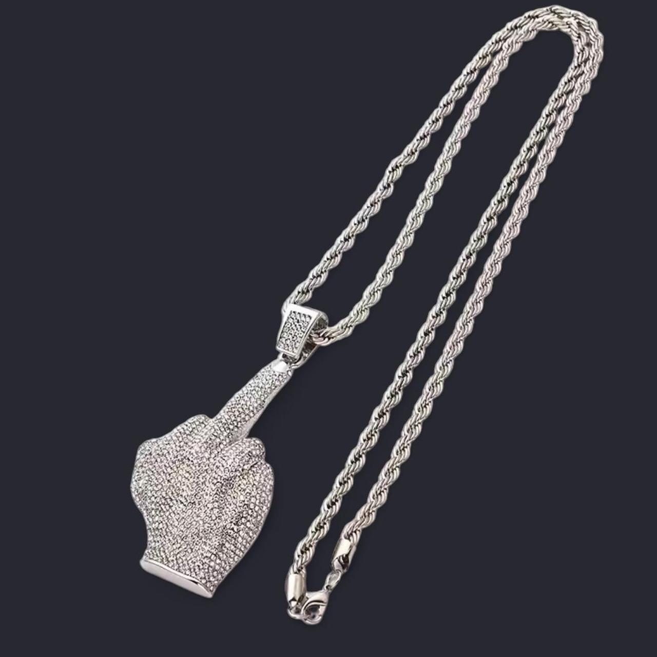 Silver and gold iced out middle finger pendant... | Depop