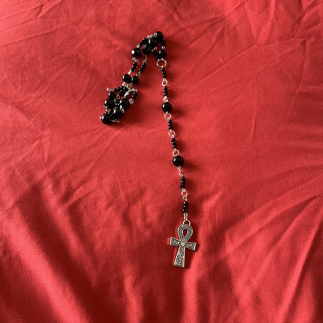 Simple black rosary style necklace with unk charm.... - Depop