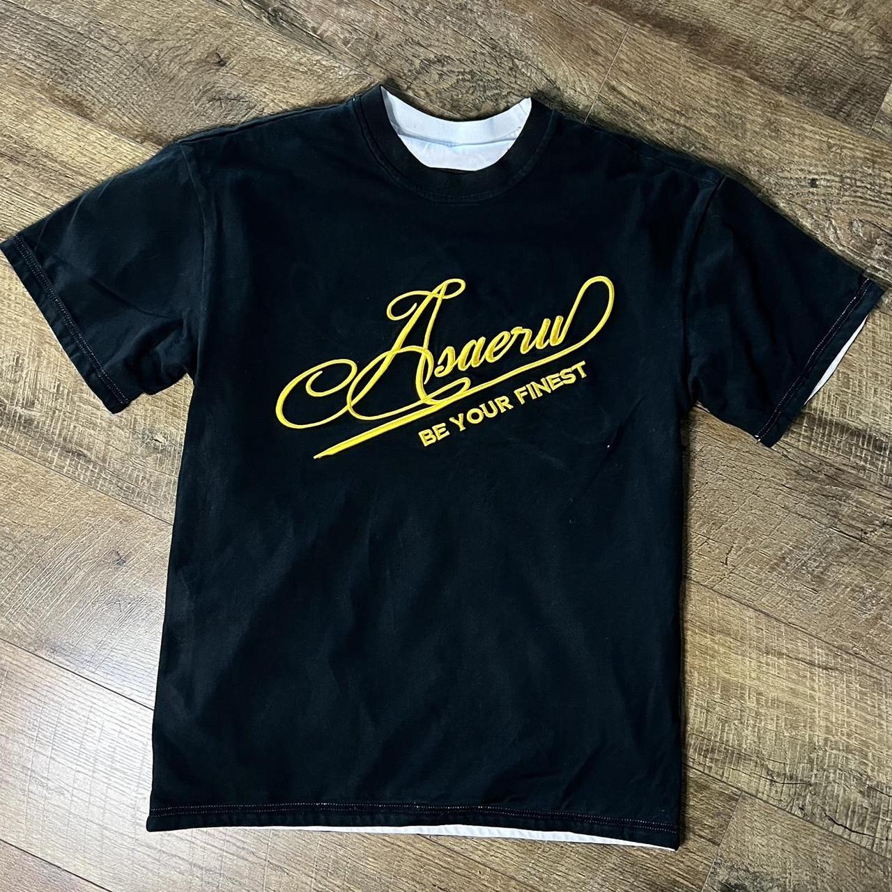 Random shirt i own. Black tee gold embroidered words... - Depop