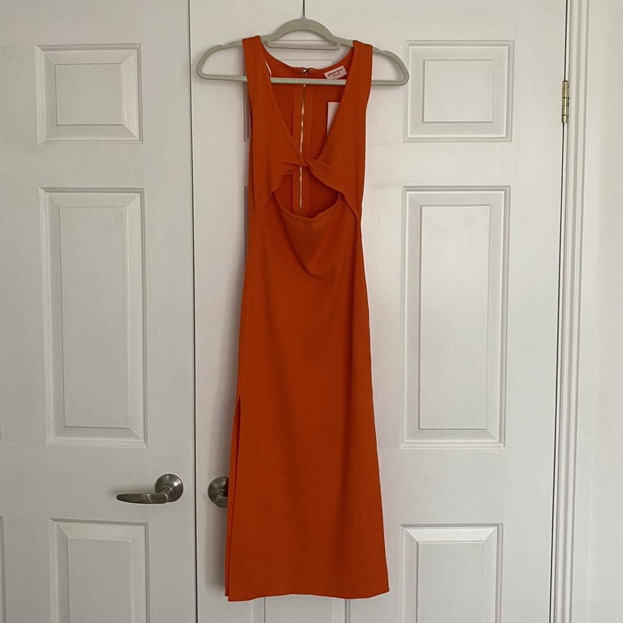Showpo orange knit dress with twist cut out feature... - Depop