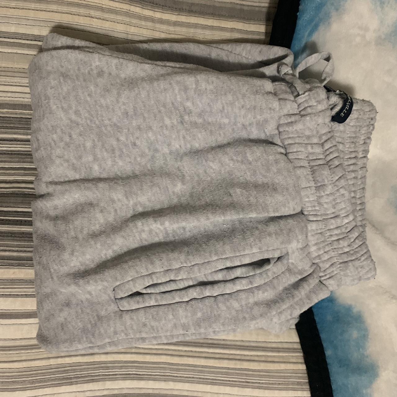 Grey sweatpants with a relaxed fit fraying around... | Depop