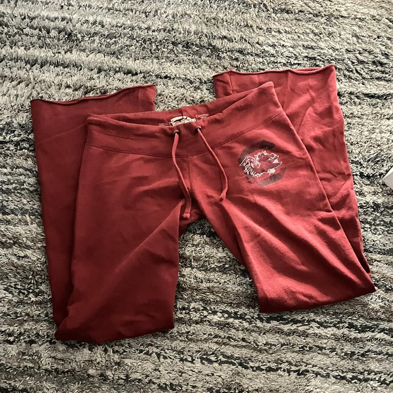 Red low rise gamecocks flare sweatpants logo is... - Depop