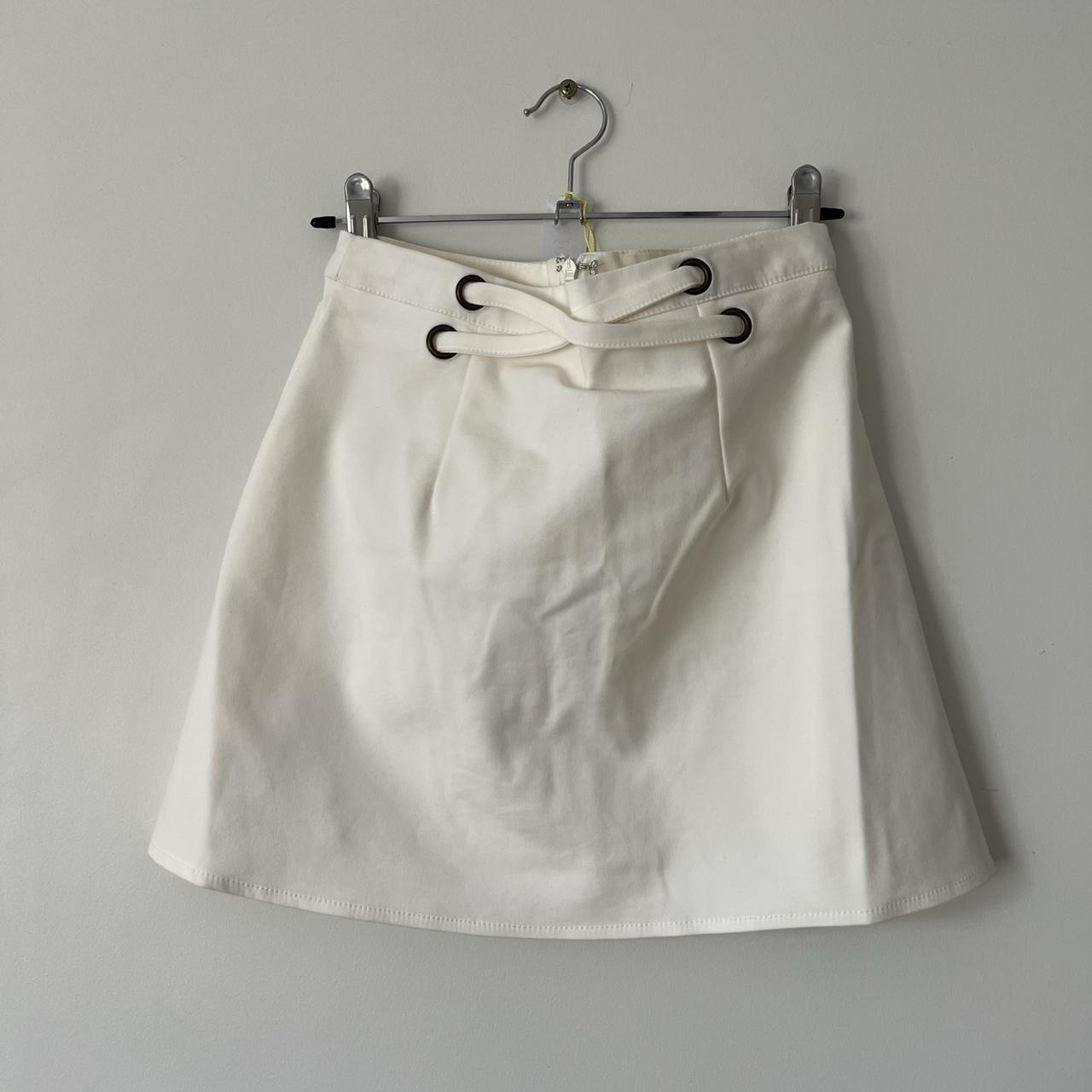 White cross over detail mini skirt labelled size 6 - Depop