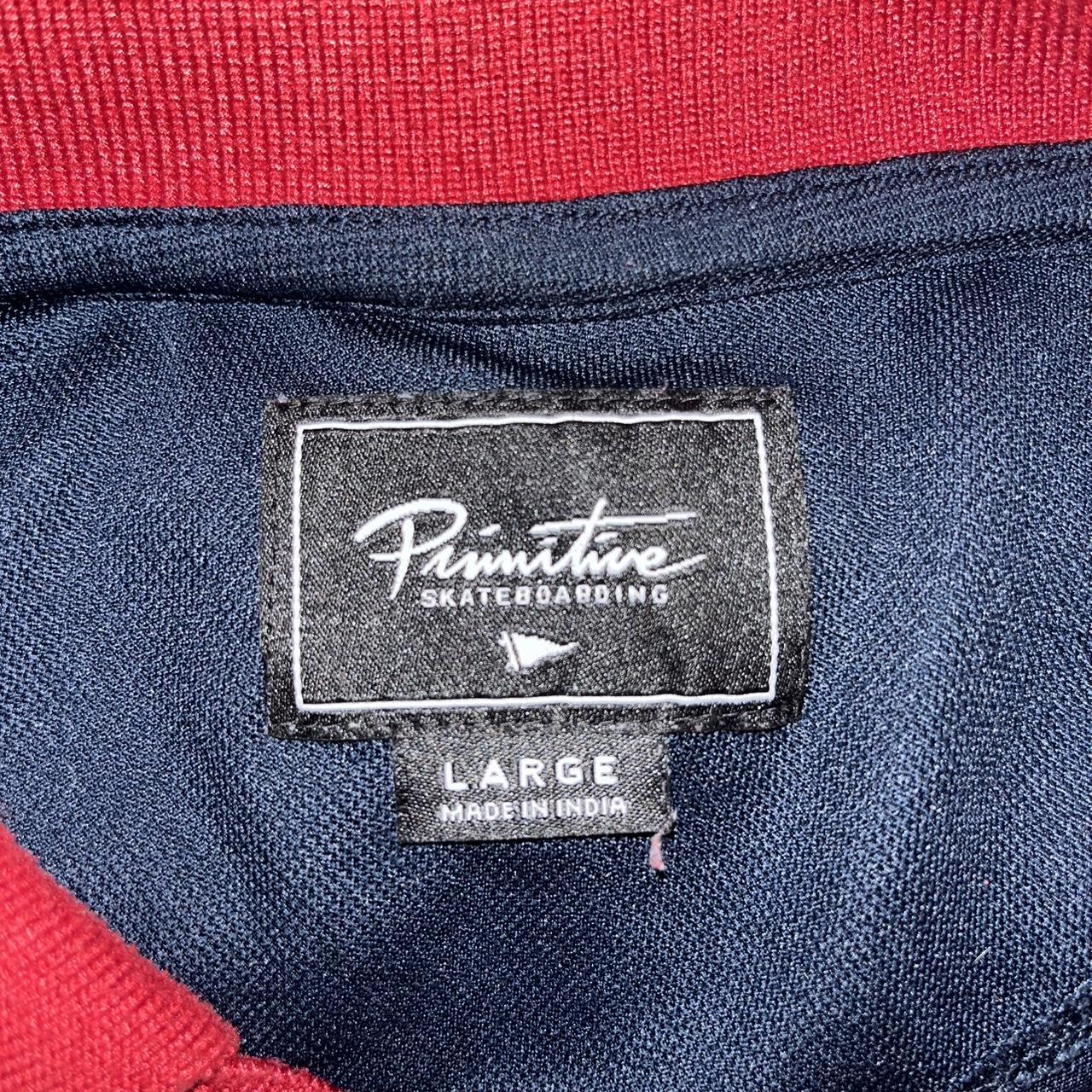 Navy Primitive Skateboards jersey with red collar... - Depop