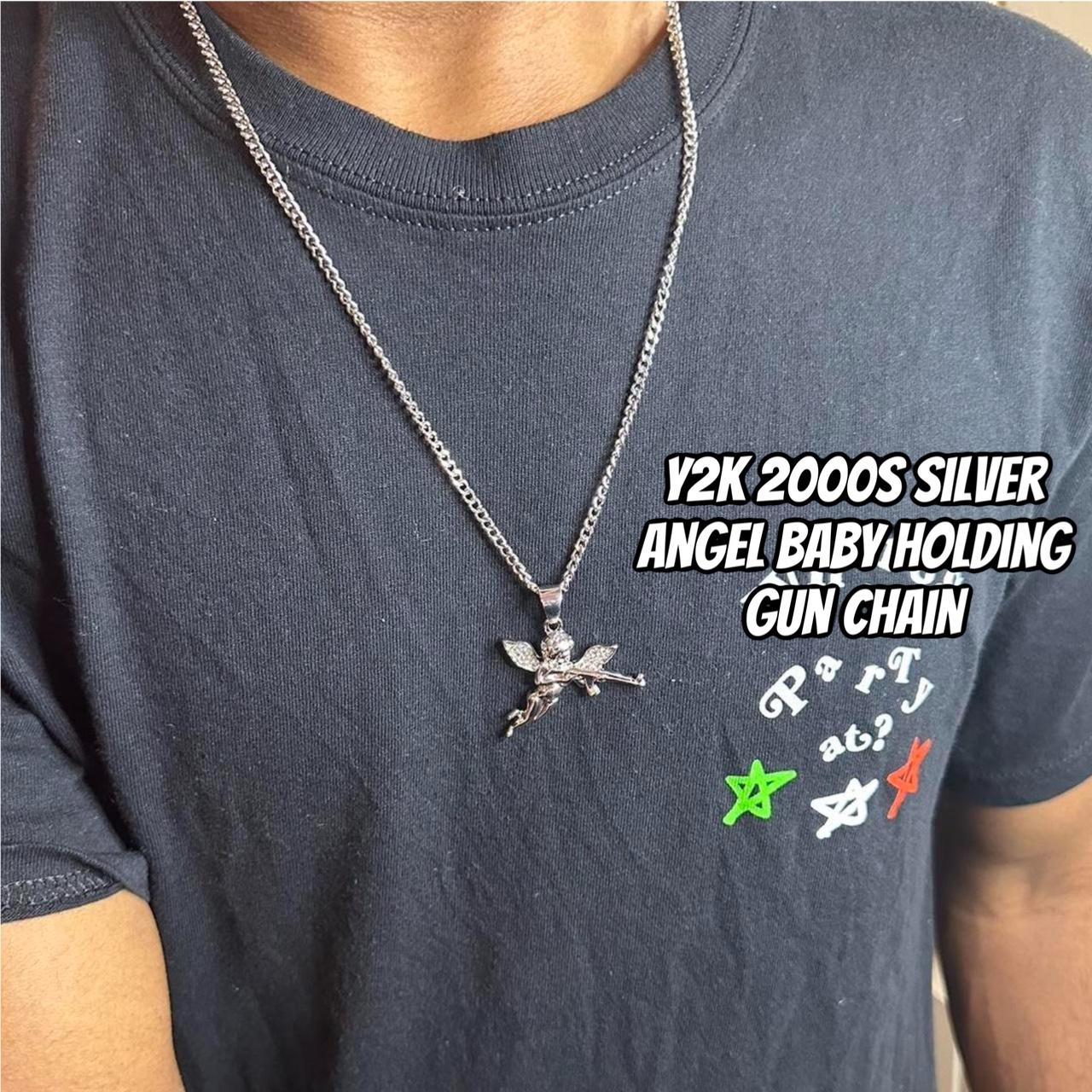 y2k 2000s silver angel baby holding gun chain ... - Depop