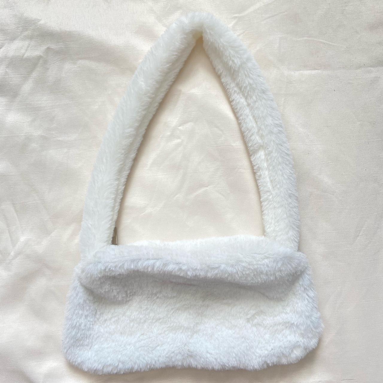 small white fluffy bag. super cute for little items... - Depop