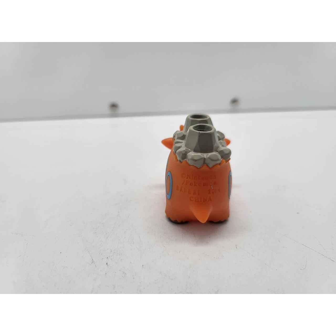 Camerupt Finger puppet figure. Authentic... - Depop