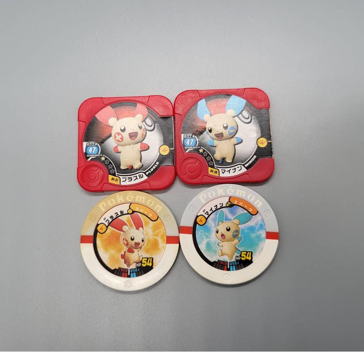 This TOMY token is used in official Pokemon arcade... - Depop