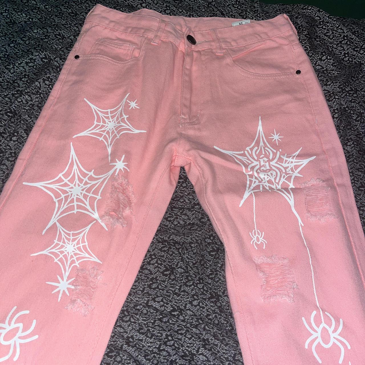 Light pink ripped jeans with spider design, size 28... - Depop