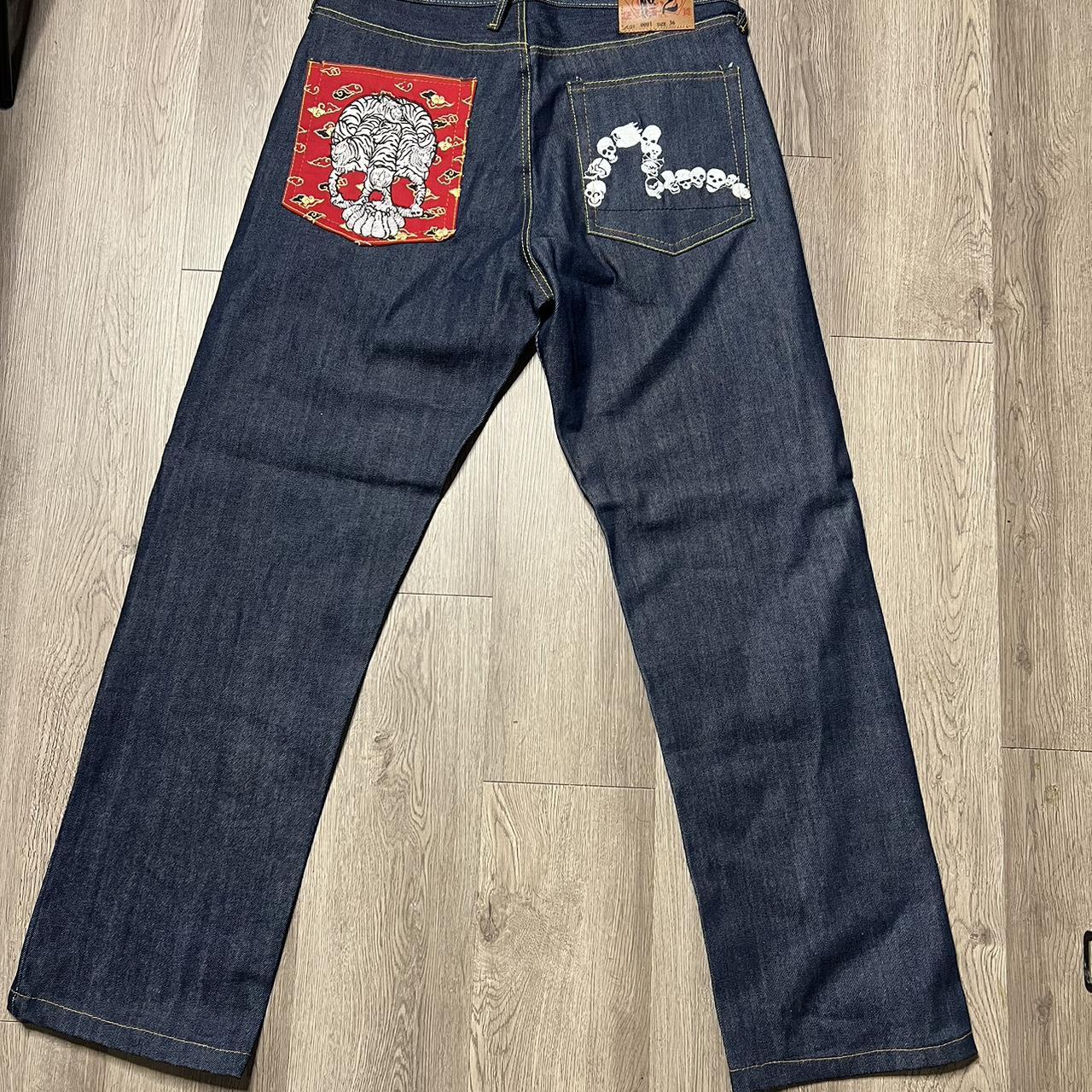 Evisu jeans with skull and crossbones embroidery and... - Depop
