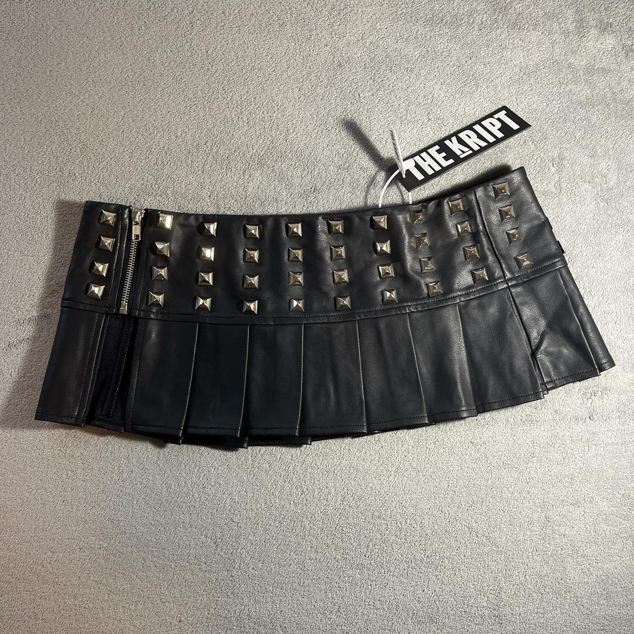 The Kript black leather mini skirt with studs -... - Depop