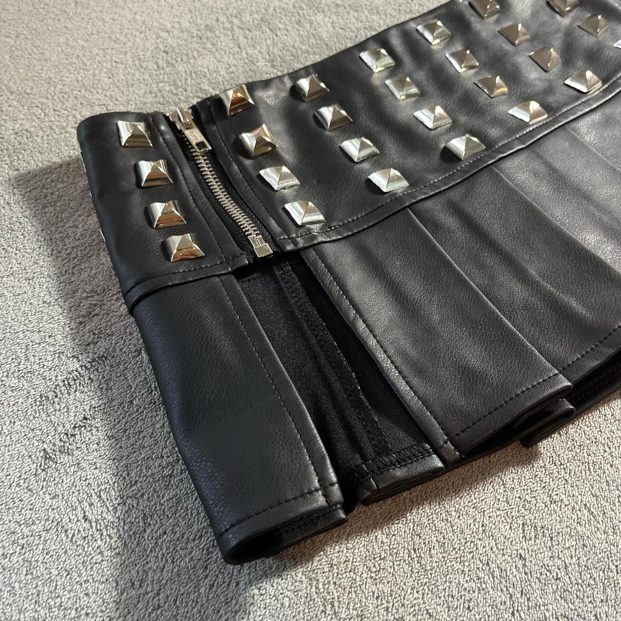 The Kript black leather mini skirt with studs -... - Depop