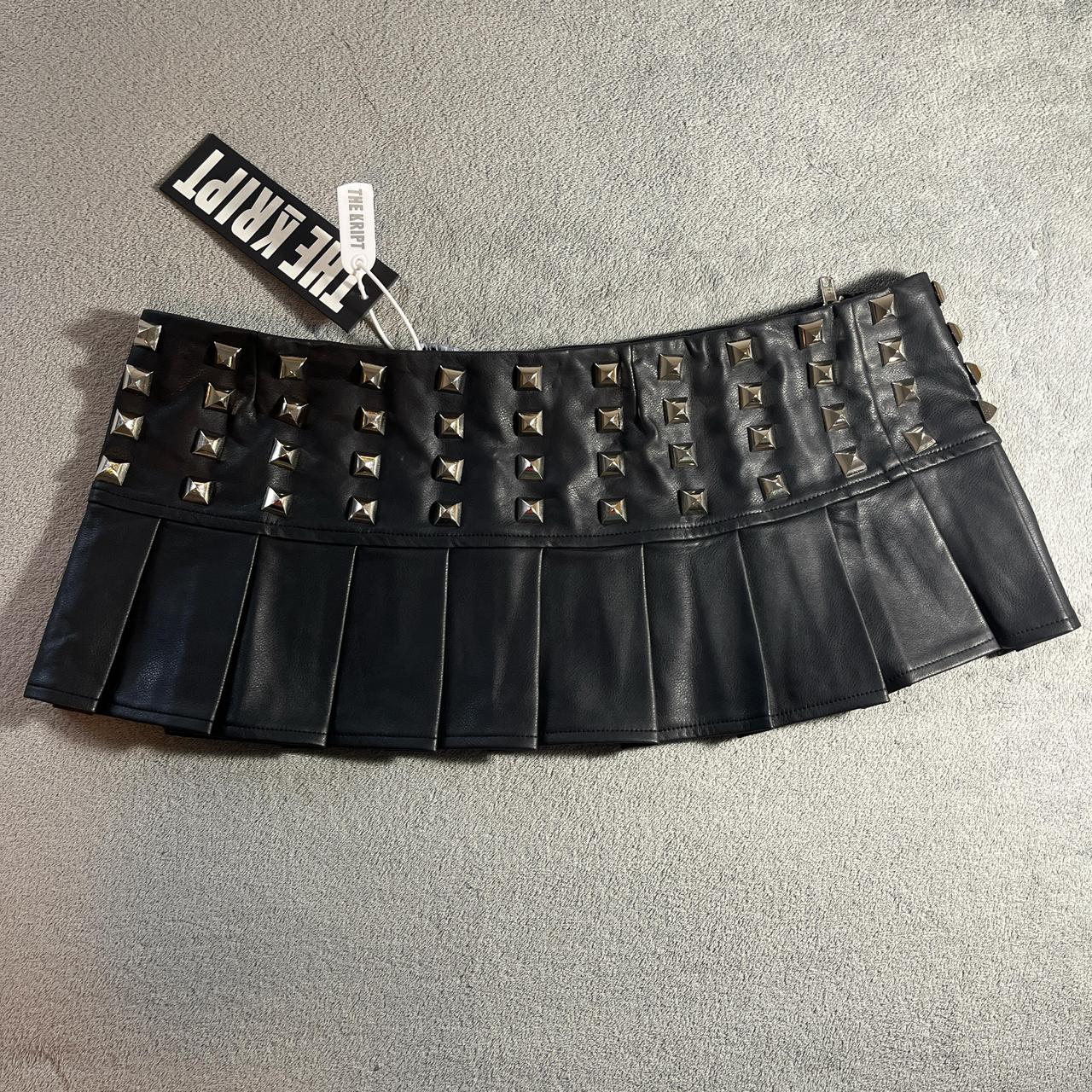 The Kript black leather mini skirt with studs -... - Depop