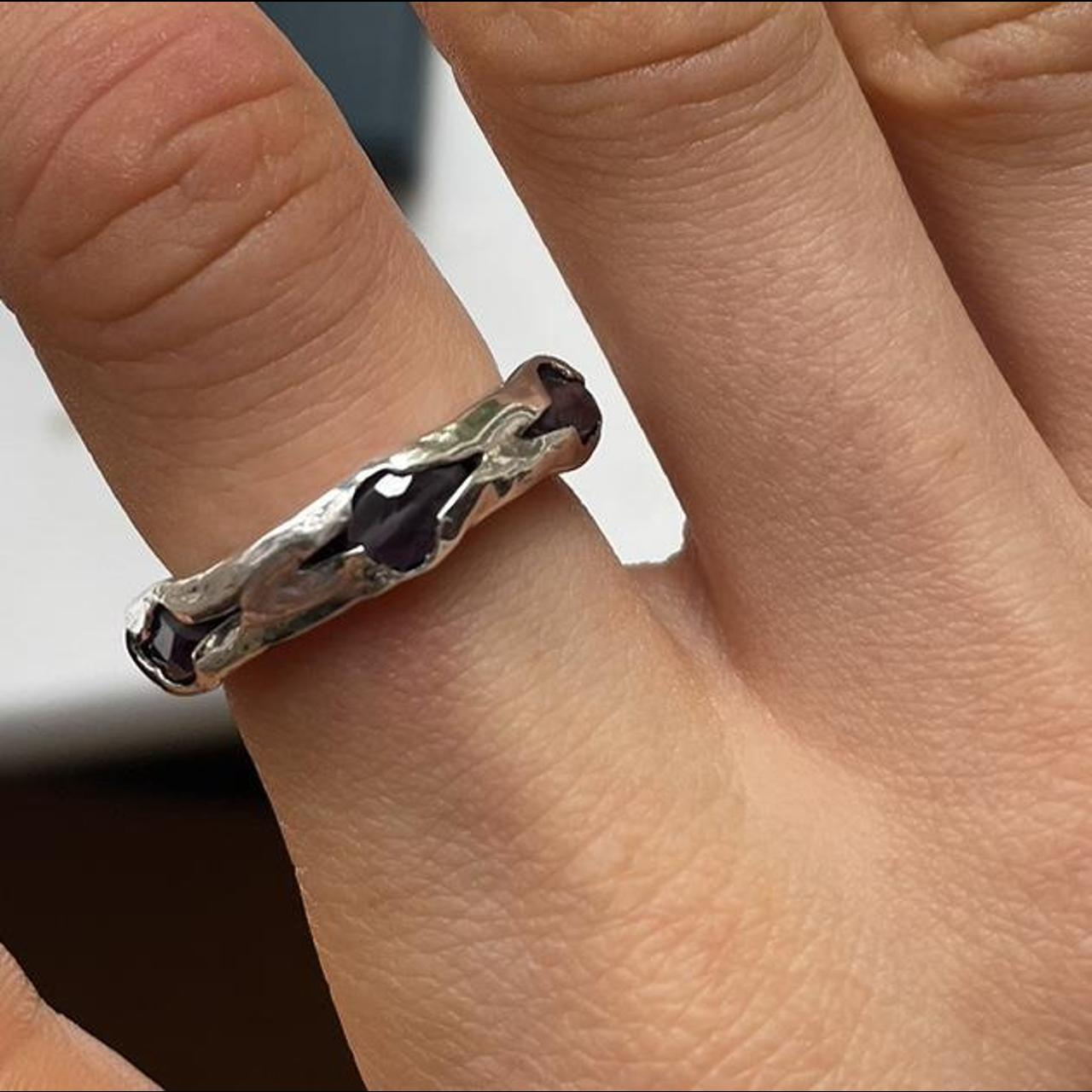 Very cool sterling silver ring set with purple... - Depop