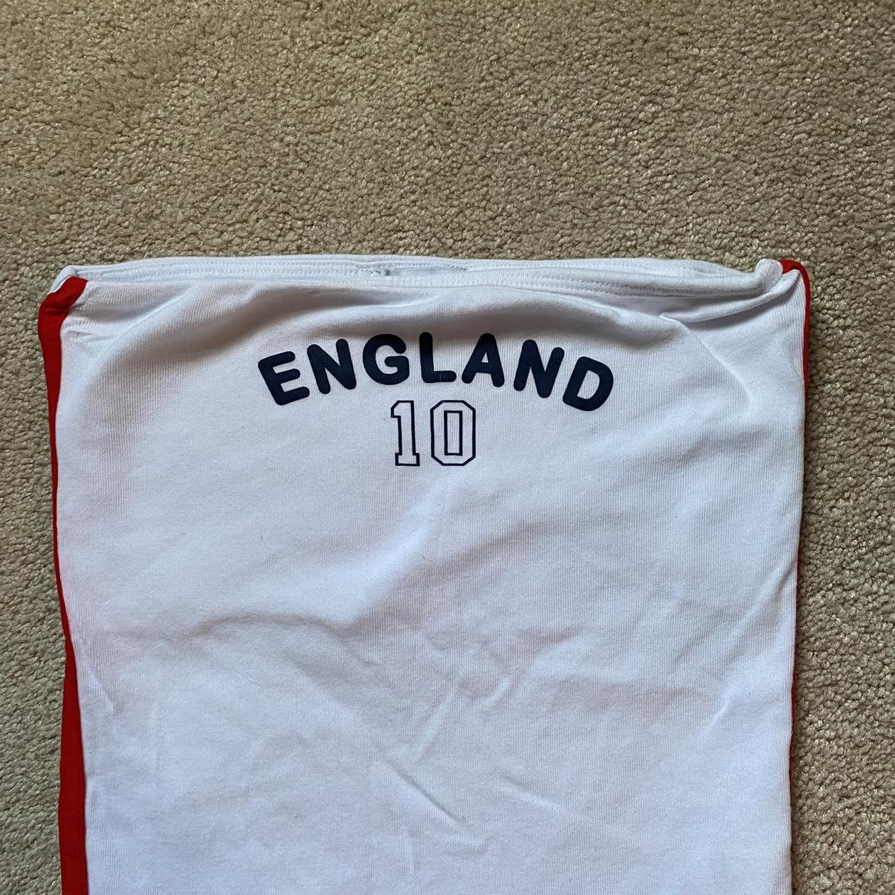 England Subdued white and red tube top Size medium... - Depop