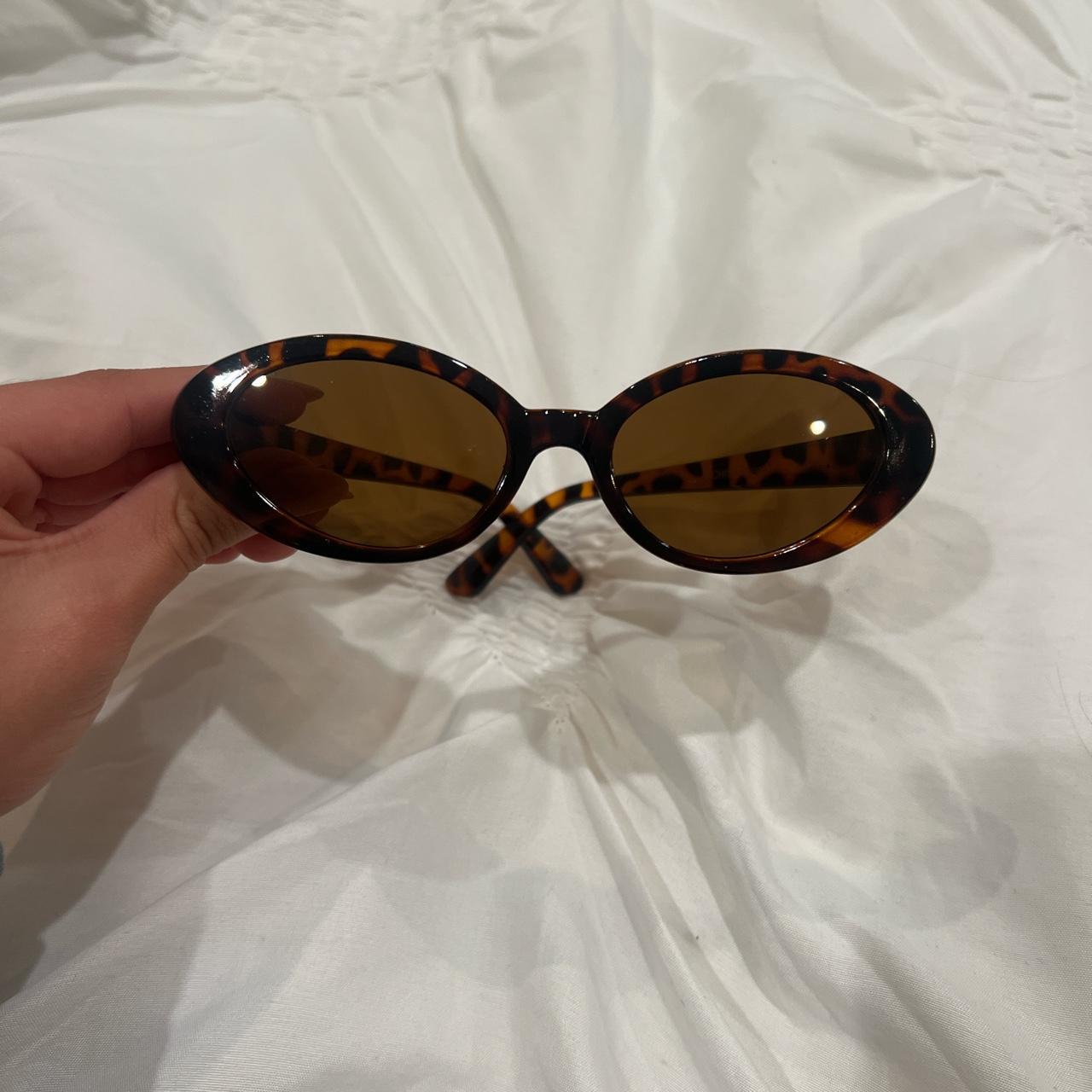 tortoise shell colored oval sunglasses bought from a... - Depop