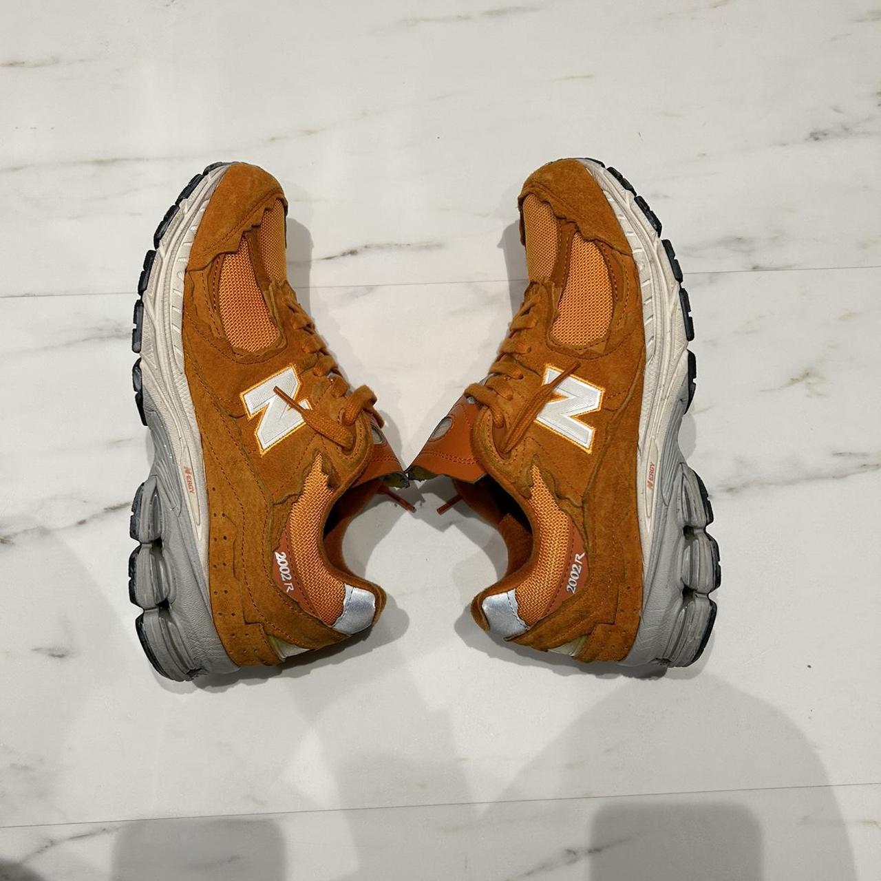 NEW BALANCE PROTECTION PACK 2002R Orange UK9 9/10... - Depop