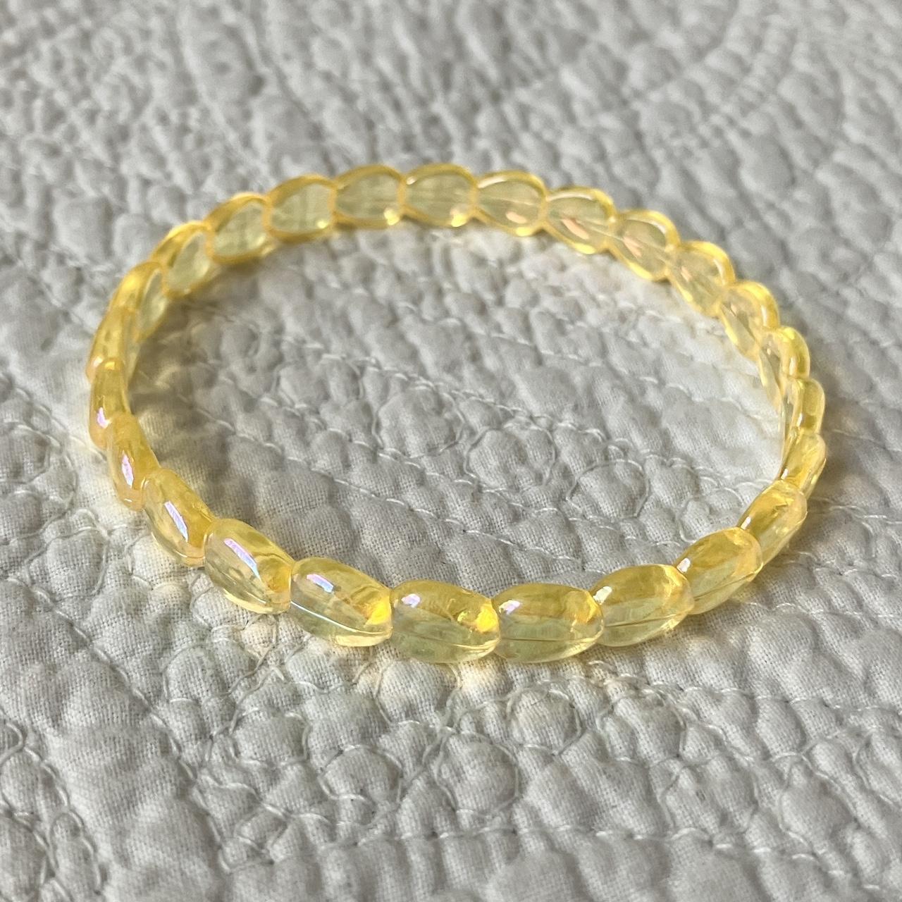 Iridescent yellow acrylic rope patterned bangle... | Depop