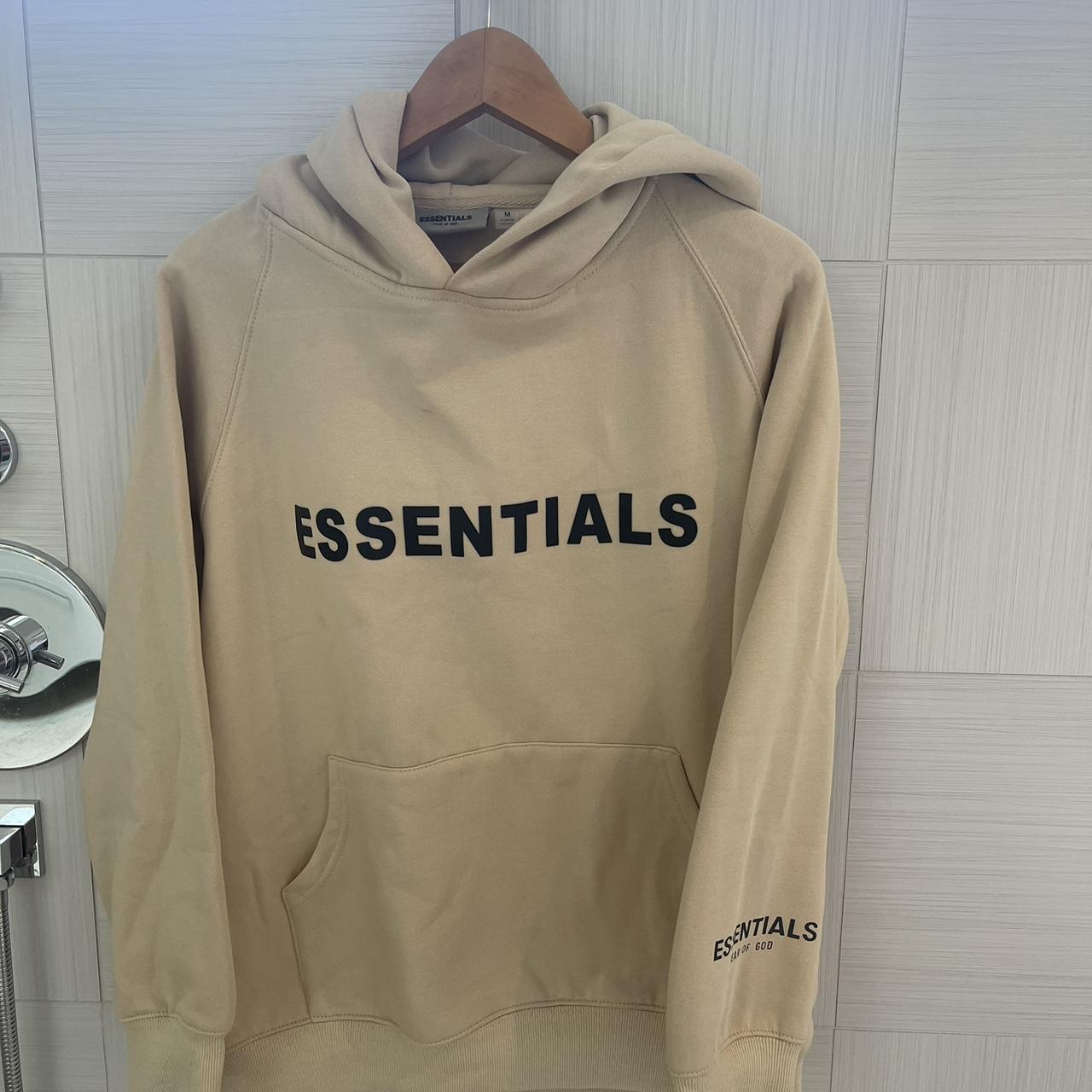 Essentials Women's Cream and Black Hoodie | Depop