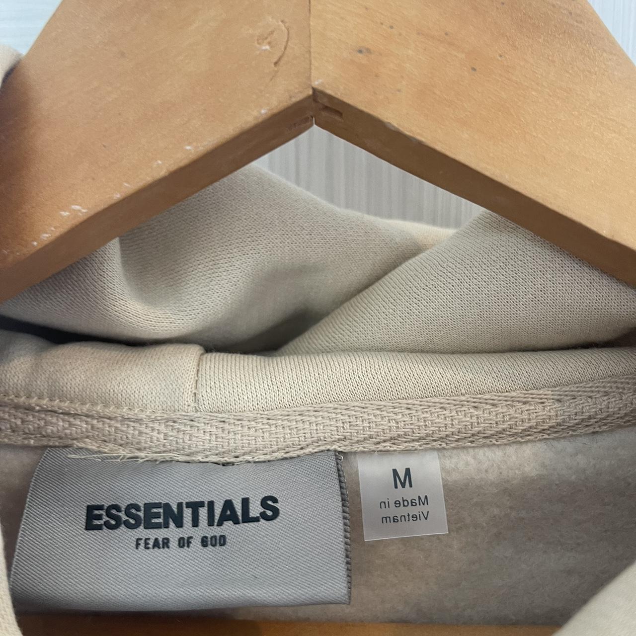 Essentials Women's Cream and Black Hoodie | Depop