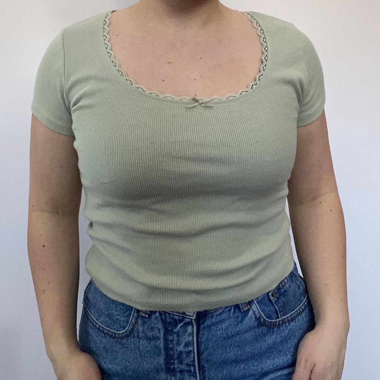 Light green ribbed top with lace detailing around... | Depop