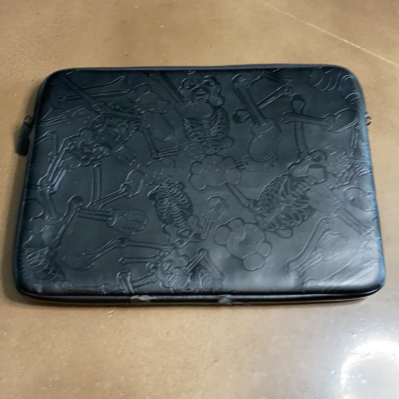 Kaws Laptop Case Case is cracking due to age. 7/10... - Depop