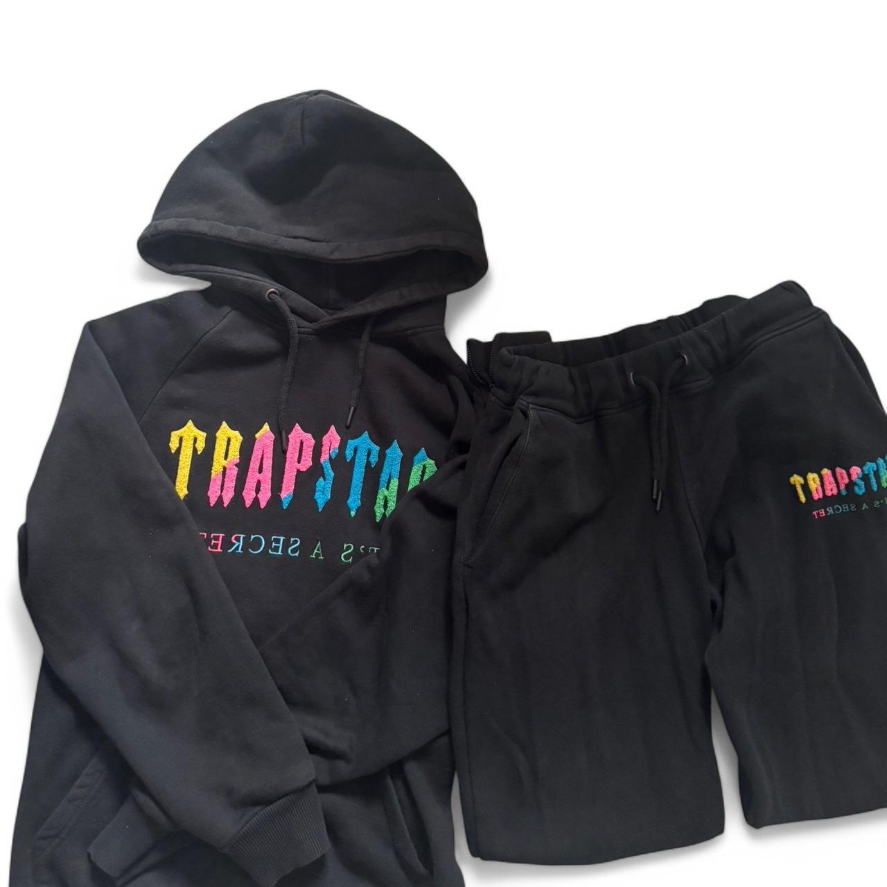 Black Trapstar tracksuit with multi-coloured logo on... | Depop