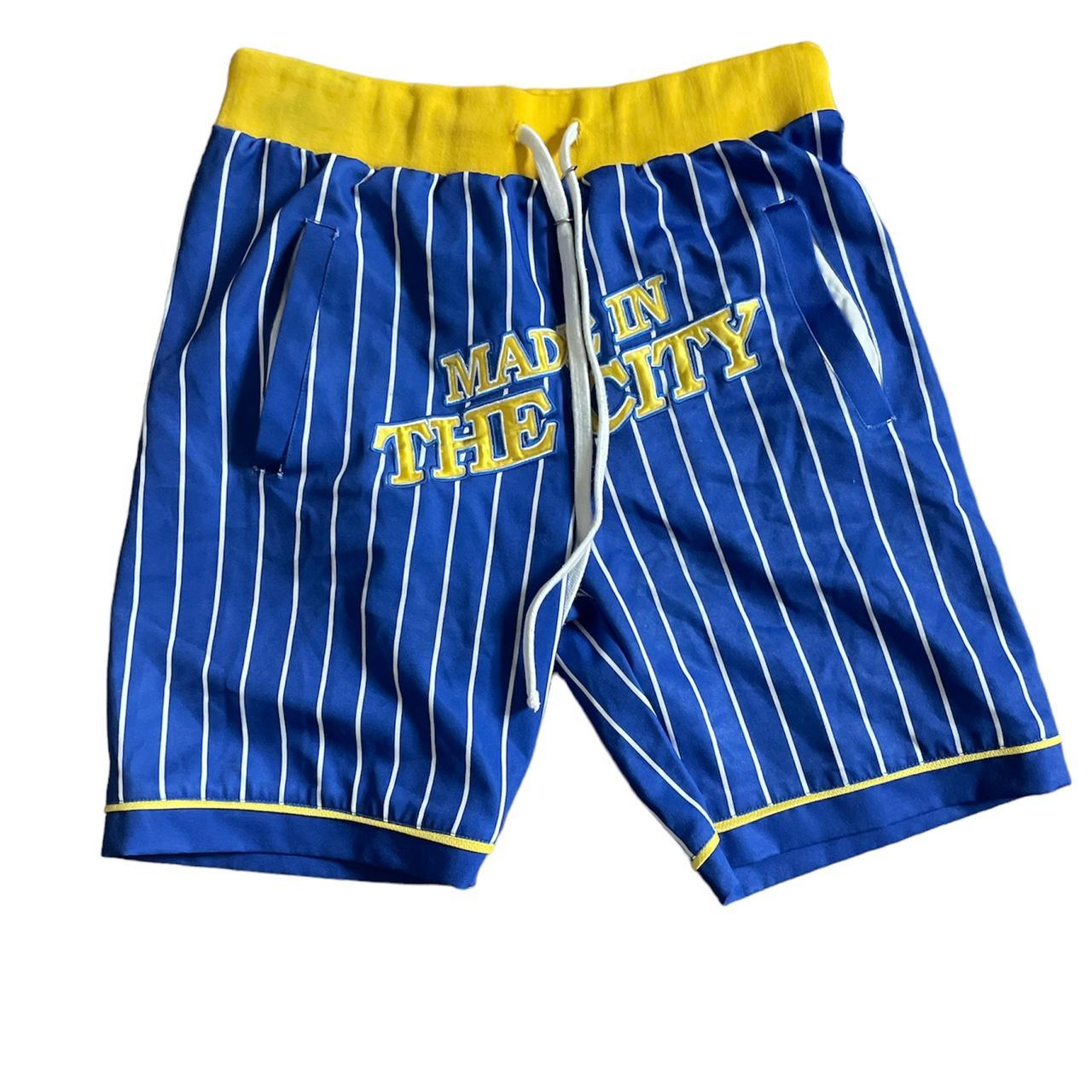 Made in The City blue and yellow shorts. With text... - Depop