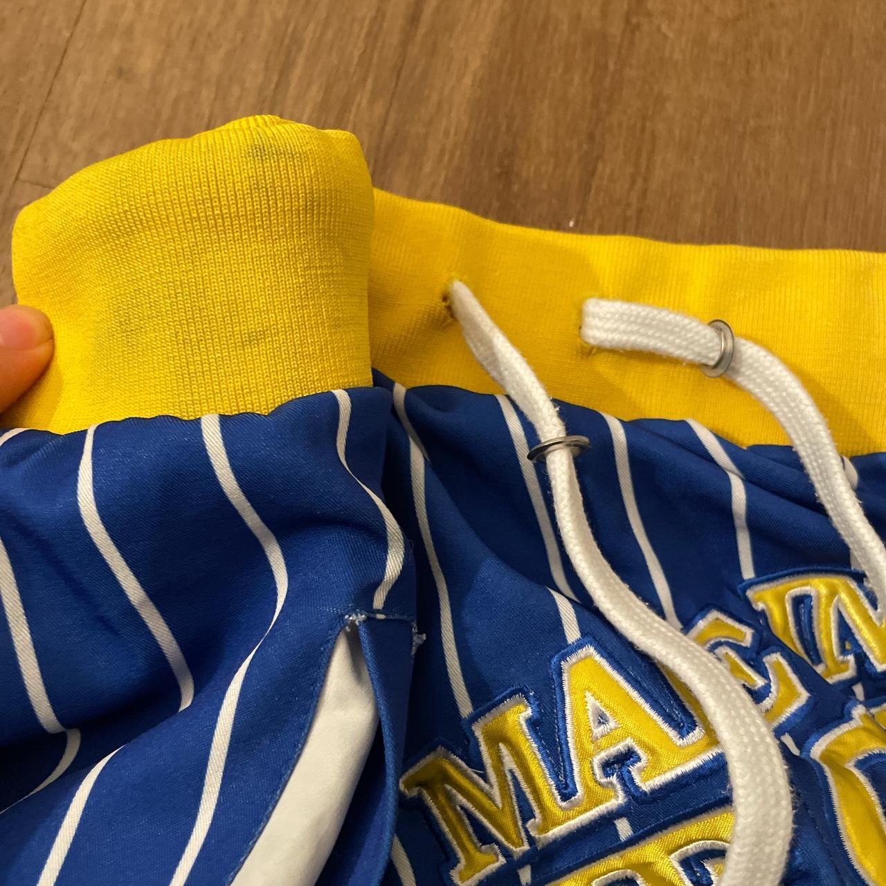 Made in The City blue and yellow shorts. With text... - Depop