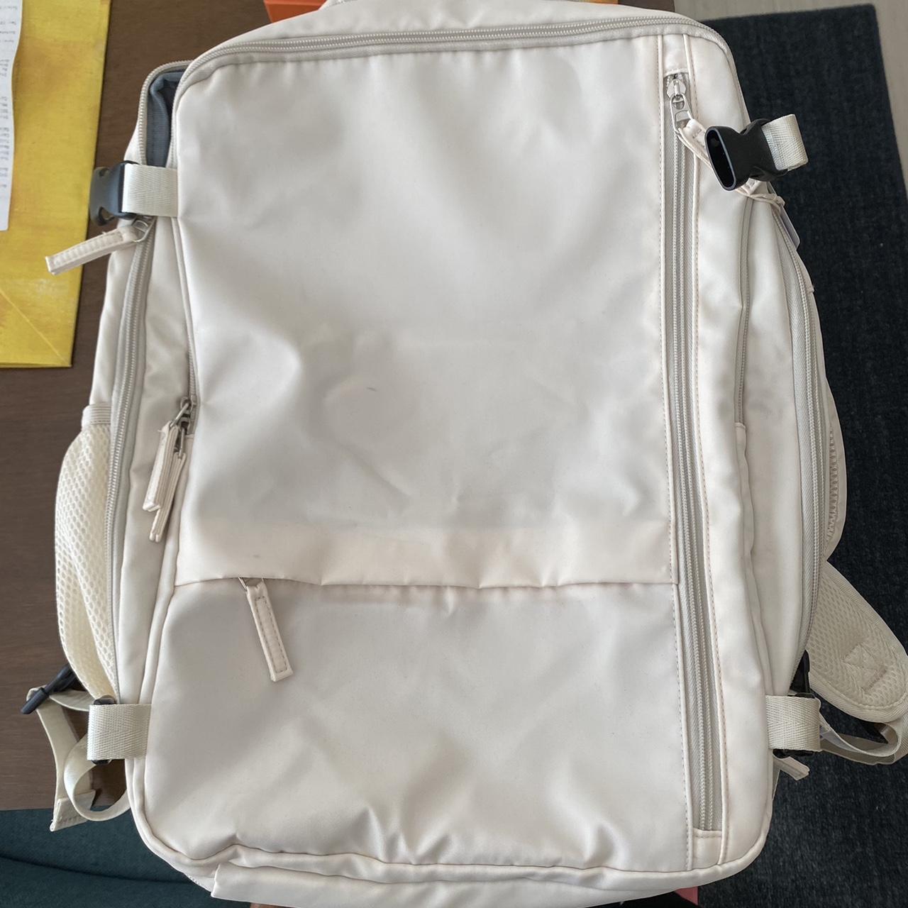 White and cream backpack with lots of pockets and a... - Depop