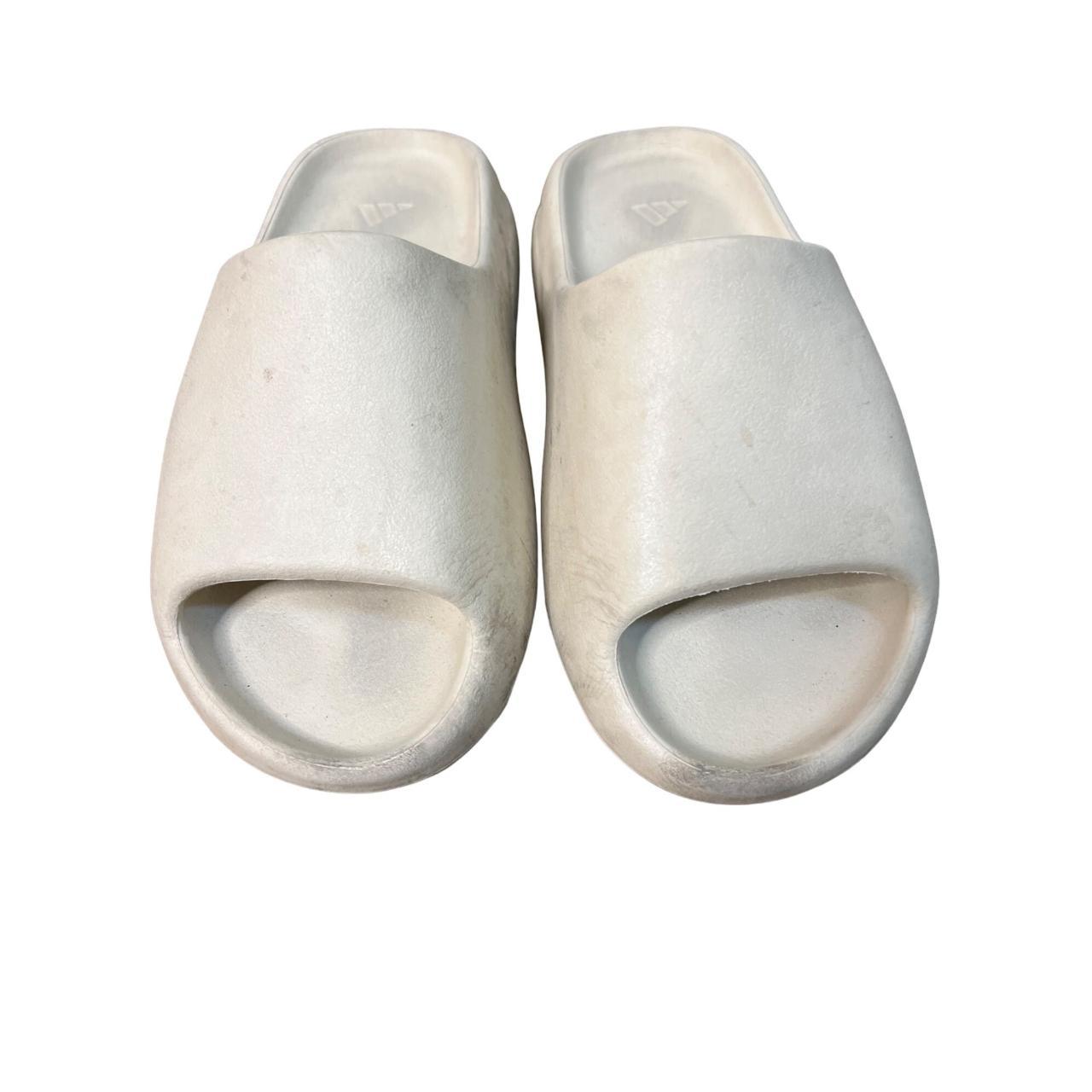 The Adidas Yeezy White Slides are a perfect blend of... - Depop